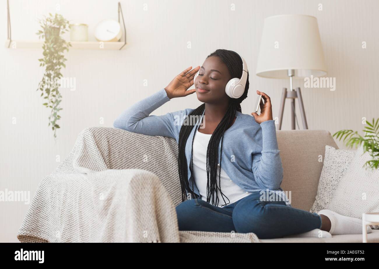 Beautiful Afro Girl Wearing Wireless Headphones, Listening Her Favorite ...