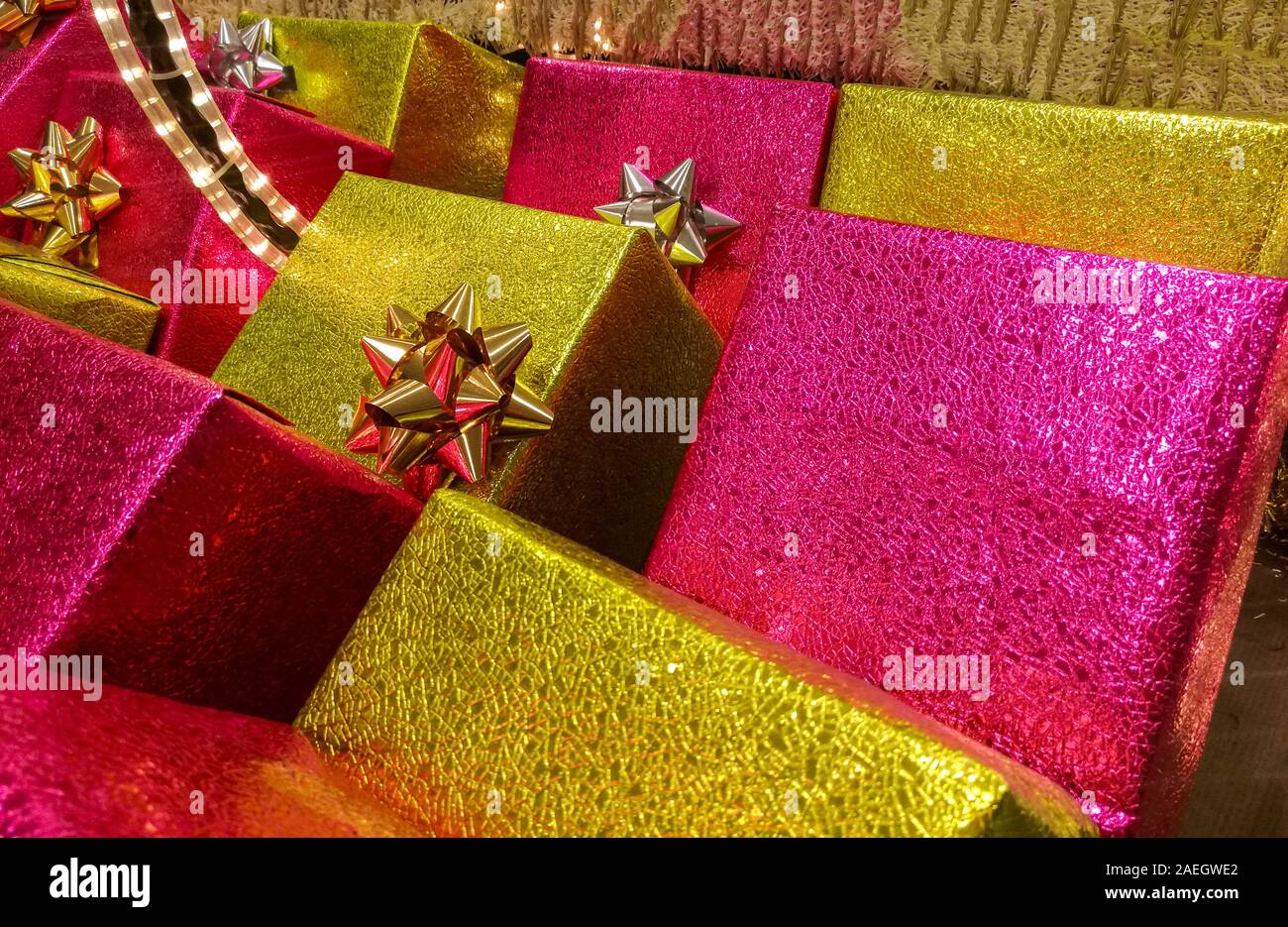 Yellow and pink glossy gift boxes Stock Photo - Alamy