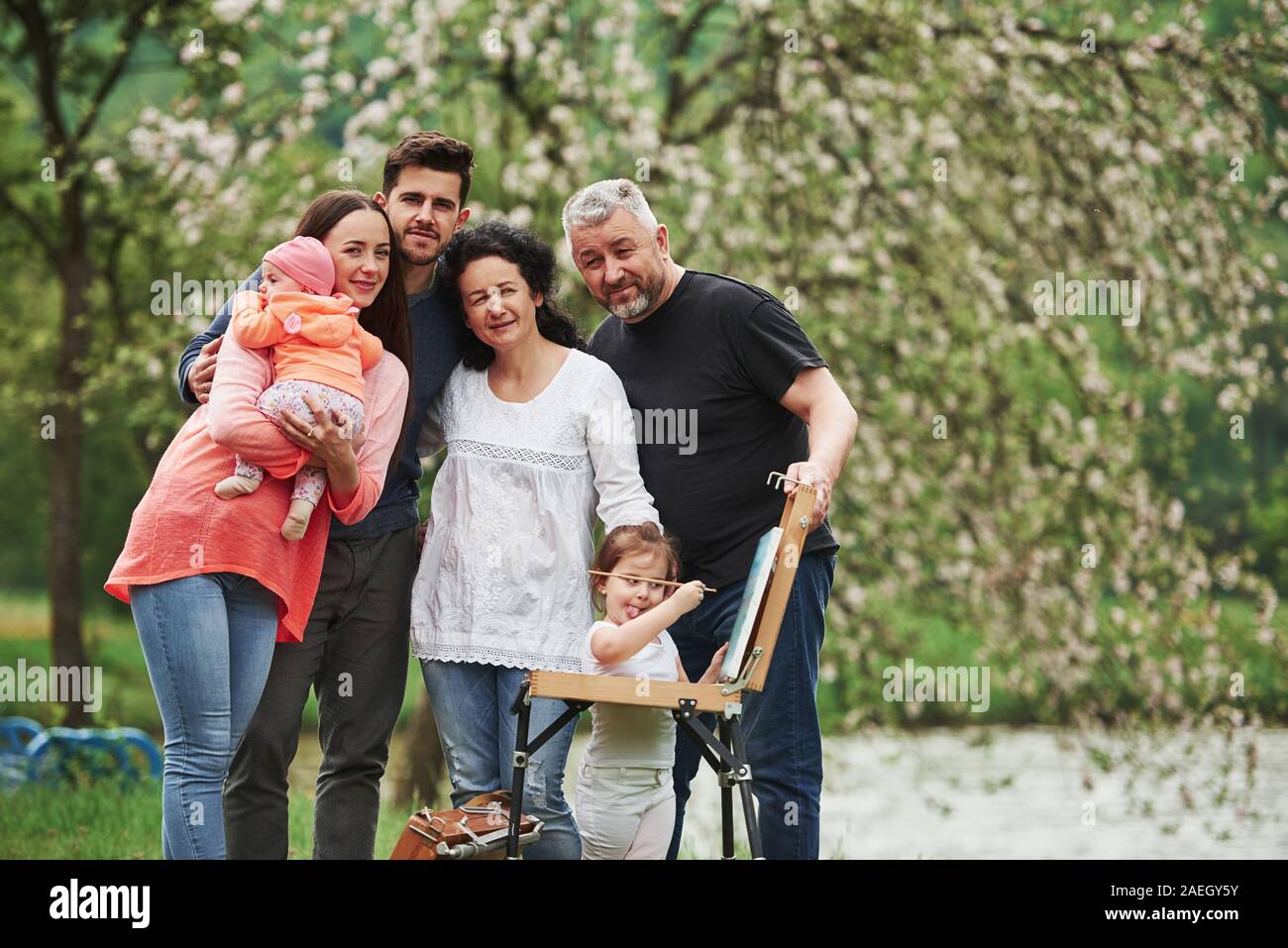 Spending weekend together. Family have good time in the parkland. Young ...