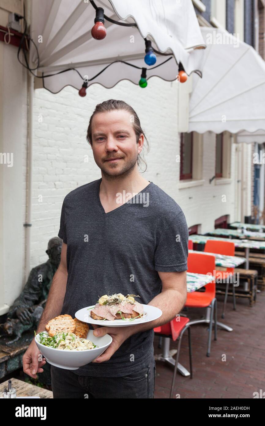 Waiter, Festina Lente bar, restaurant, Amsterdam, Netherlands Stock ...