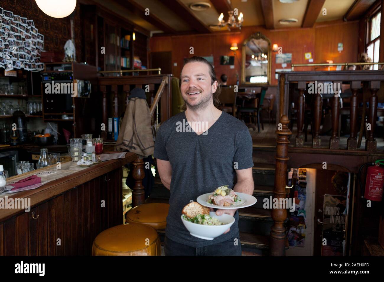 Waiter, Festina Lente bar, restaurant, Amsterdam, Netherlands Stock Photo - Alamy