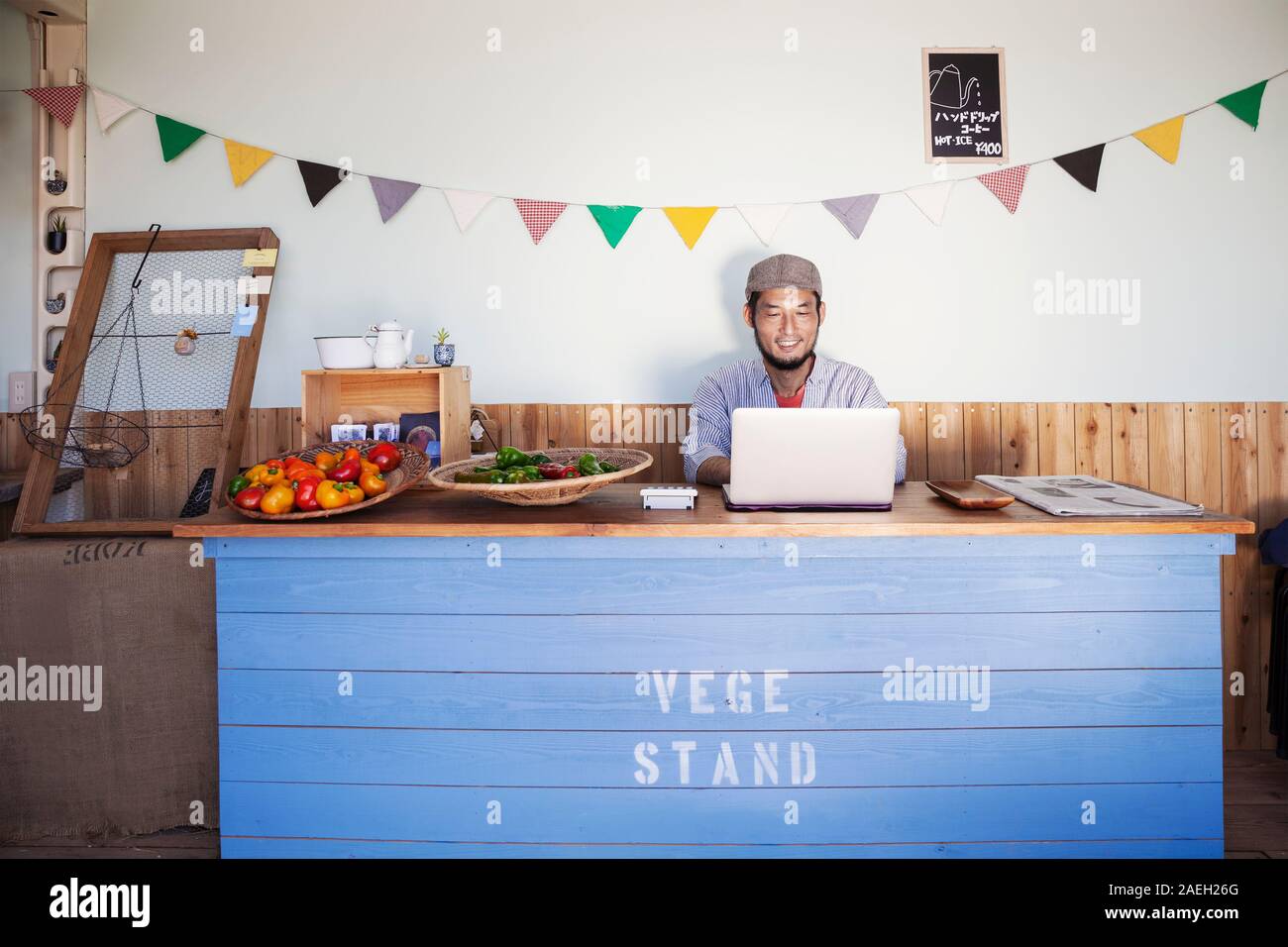 Man sitting behind the counter hi-res stock photography and images - Alamy