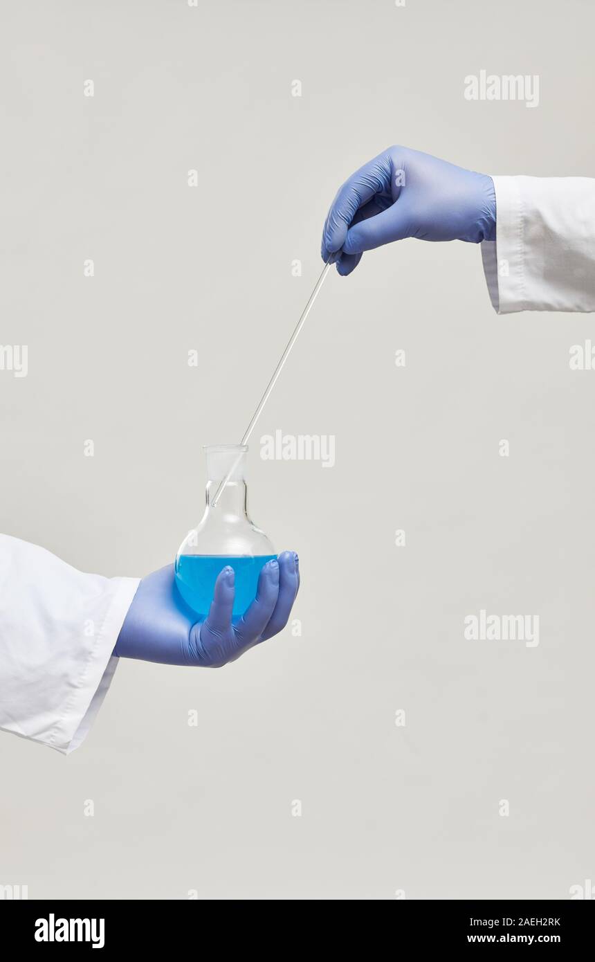 Hand holding chemical flask isolated hi-res stock photography and ...