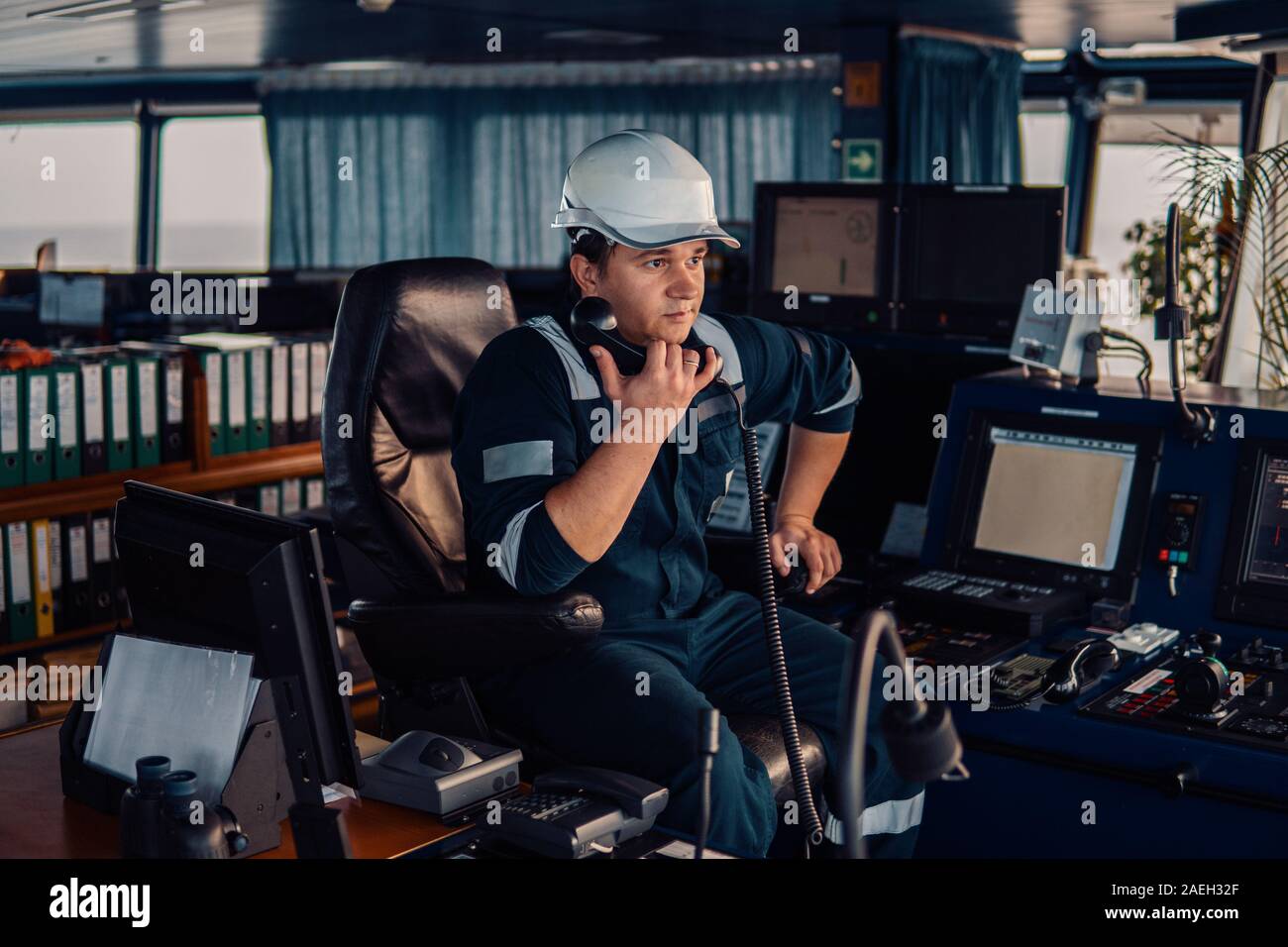 Marine navigational officer during navigational watch on Bridge . Work ...