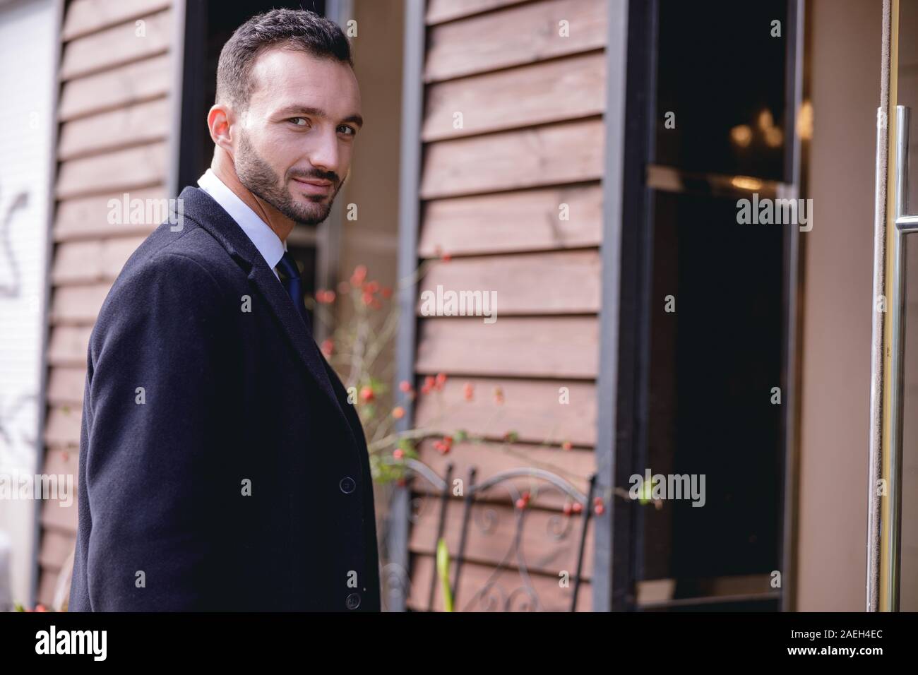 Handsome male person looking straight at camera Stock Photo - Alamy