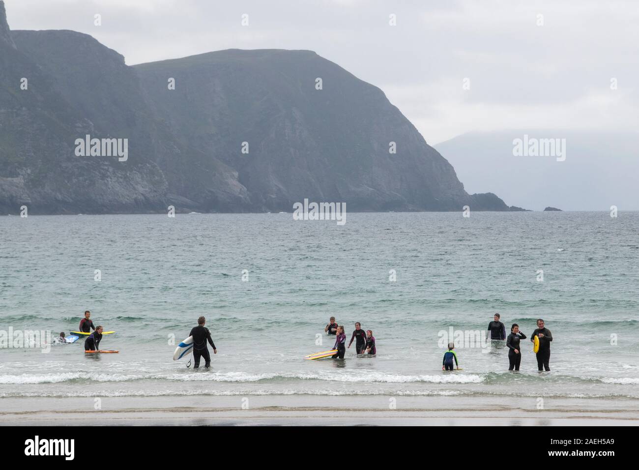 Tourist enjoying on the beach, Keel Beach, Achill Island, County Mayo ...