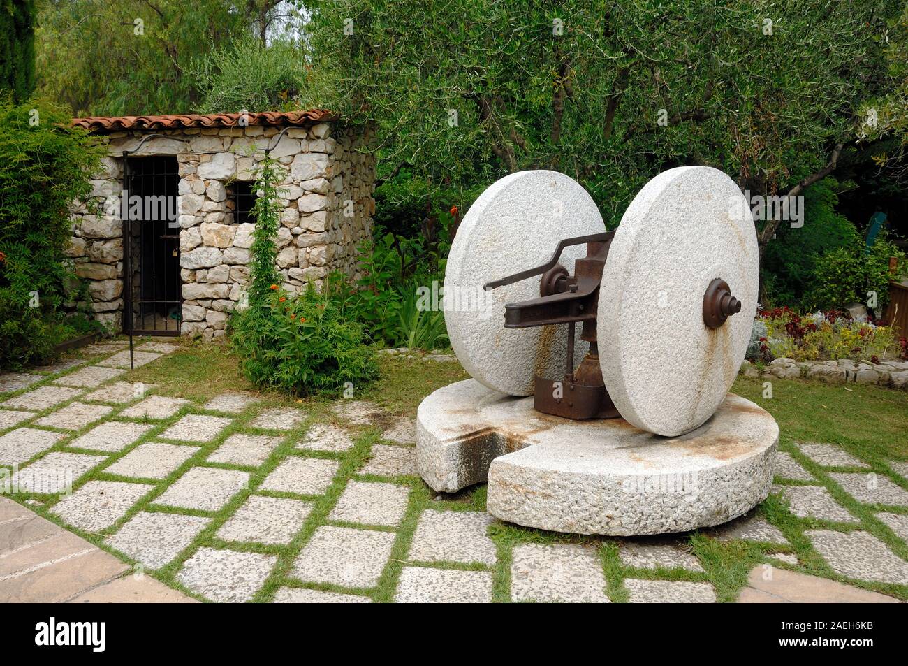Old millstone for olive oil hi-res stock photography and images - Alamy