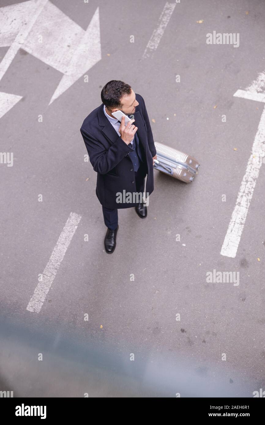 Top view picture of businessman that wheeling his luggage Stock Photo ...