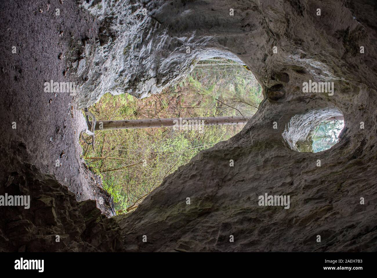 sandstone cliff with cave opening from inside Stock Photo - Alamy