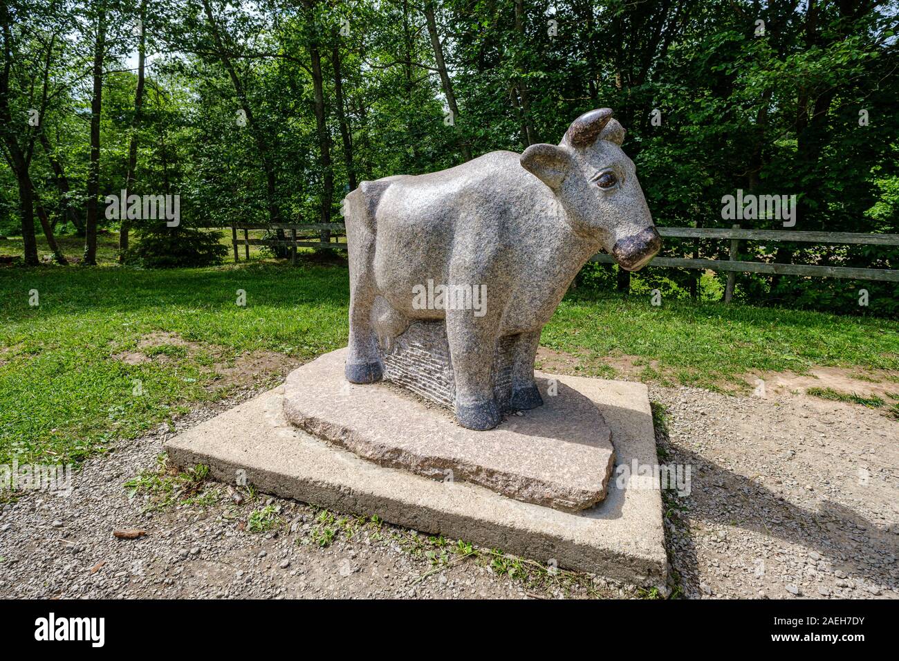 statue of stone cow in park in summer day Stock Photo - Alamy