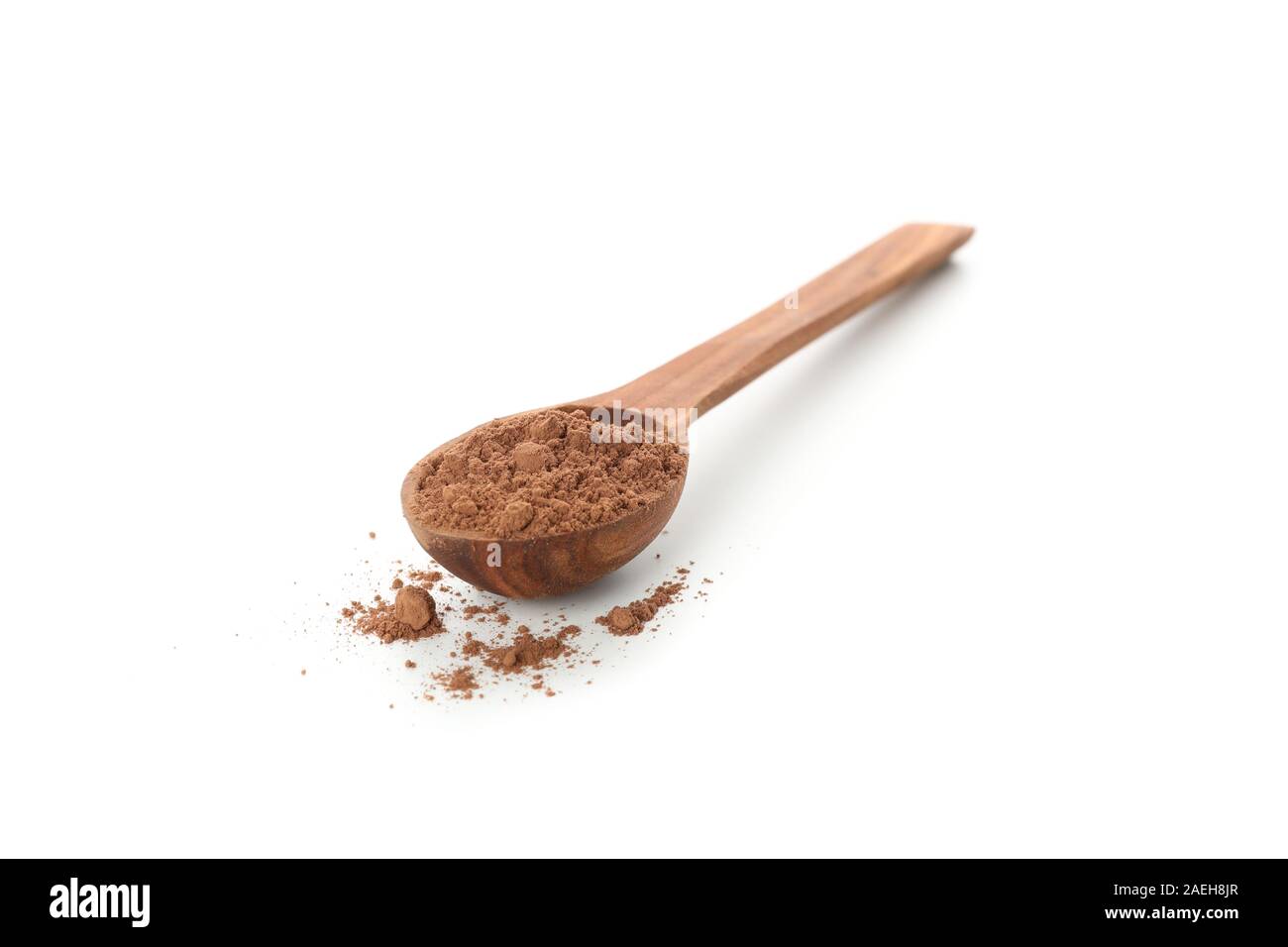 Wooden spoon with cocoa powder isolated on white background Stock Photo ...