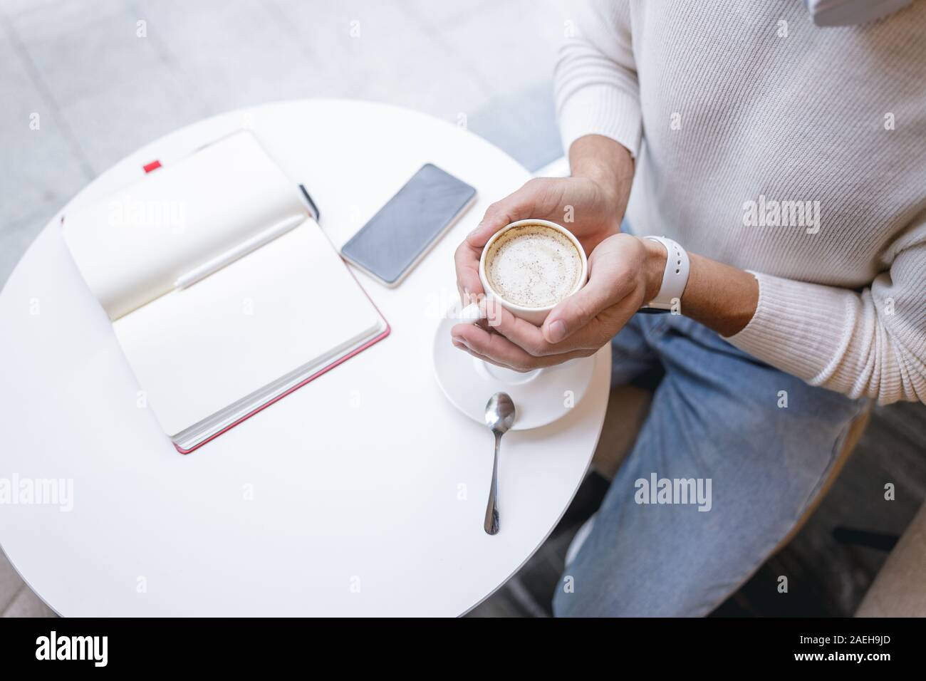 Close up of male hands that holding cup Stock Photo - Alamy