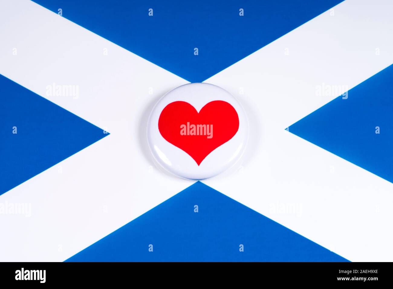 A red heart symbol, pictured over the flag of Scotland Stock Photo - Alamy
