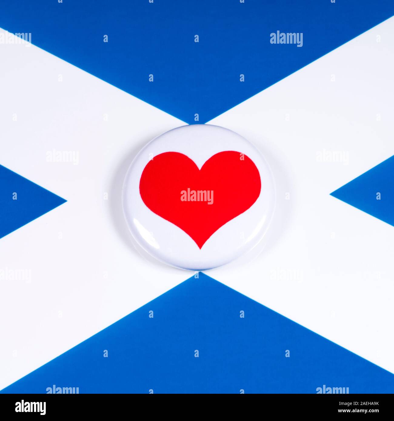 A red heart symbol, pictured over the flag of Scotland Stock Photo - Alamy