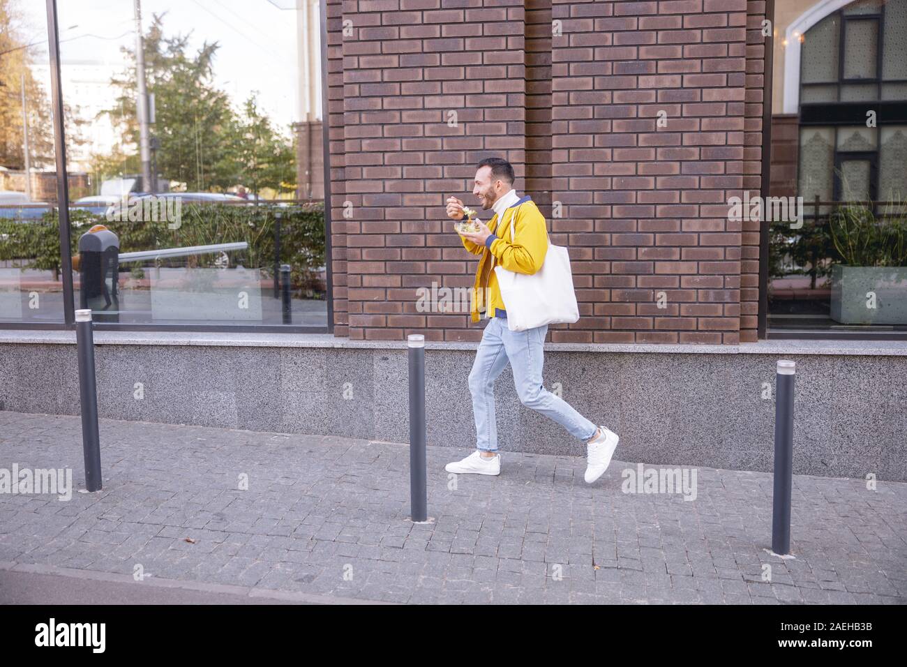 Joyful business man walking city hi-res stock photography and images ...