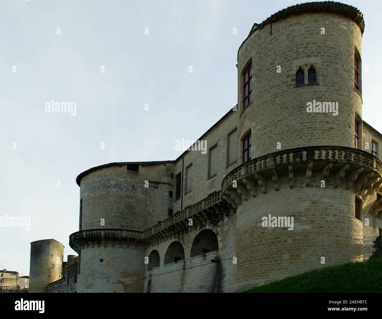 Chateau de Duras in the winter sun under blue skies, north aspect ...