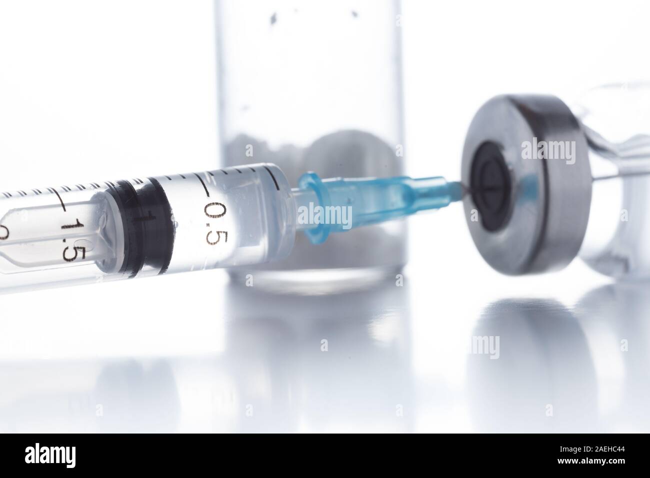 Antibiotic injection bottles with a plastic disposable syringe on a ...