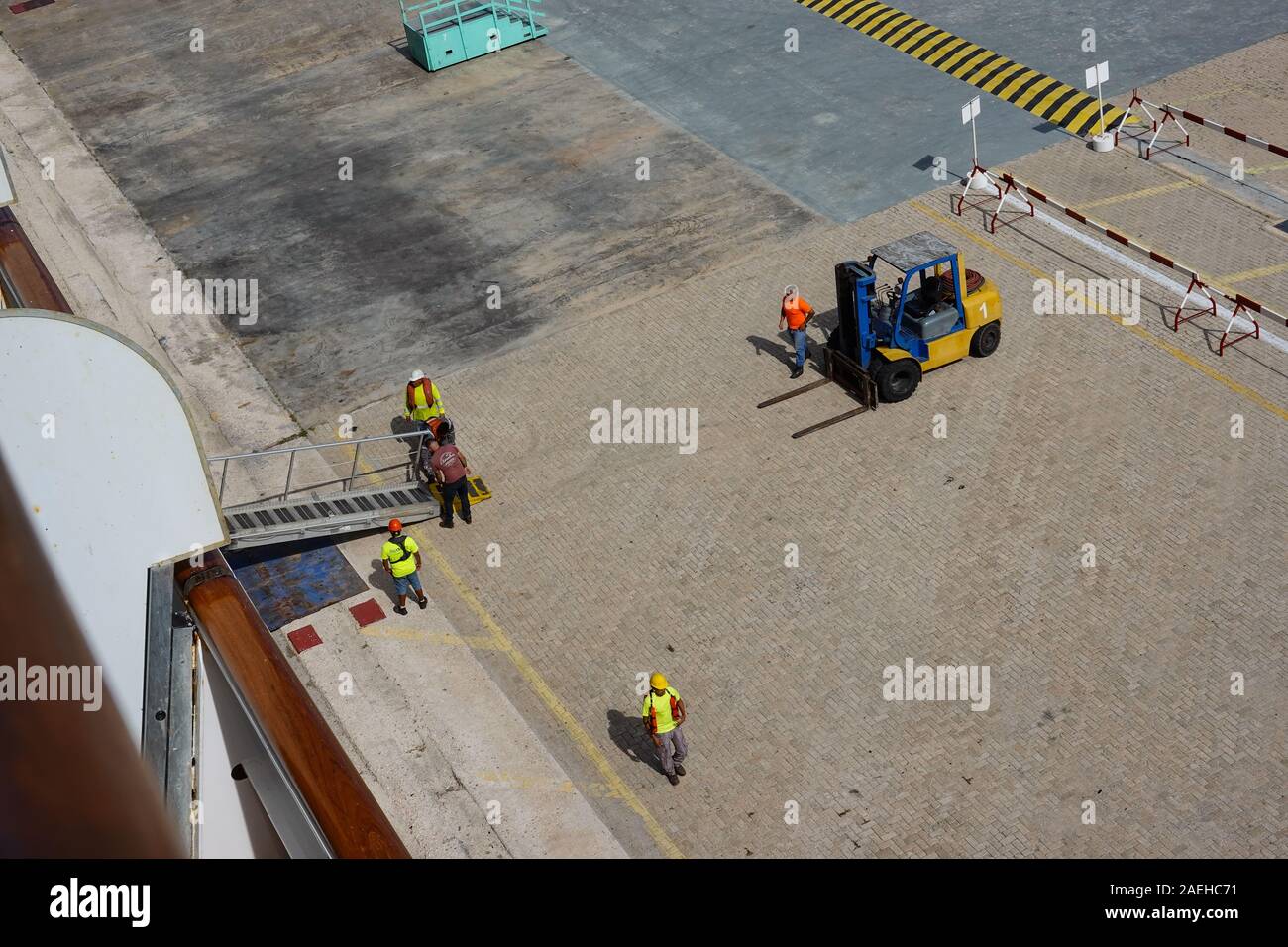 Aruba-11/4/19: Port Dock workers and cruise ship crew working hard ...