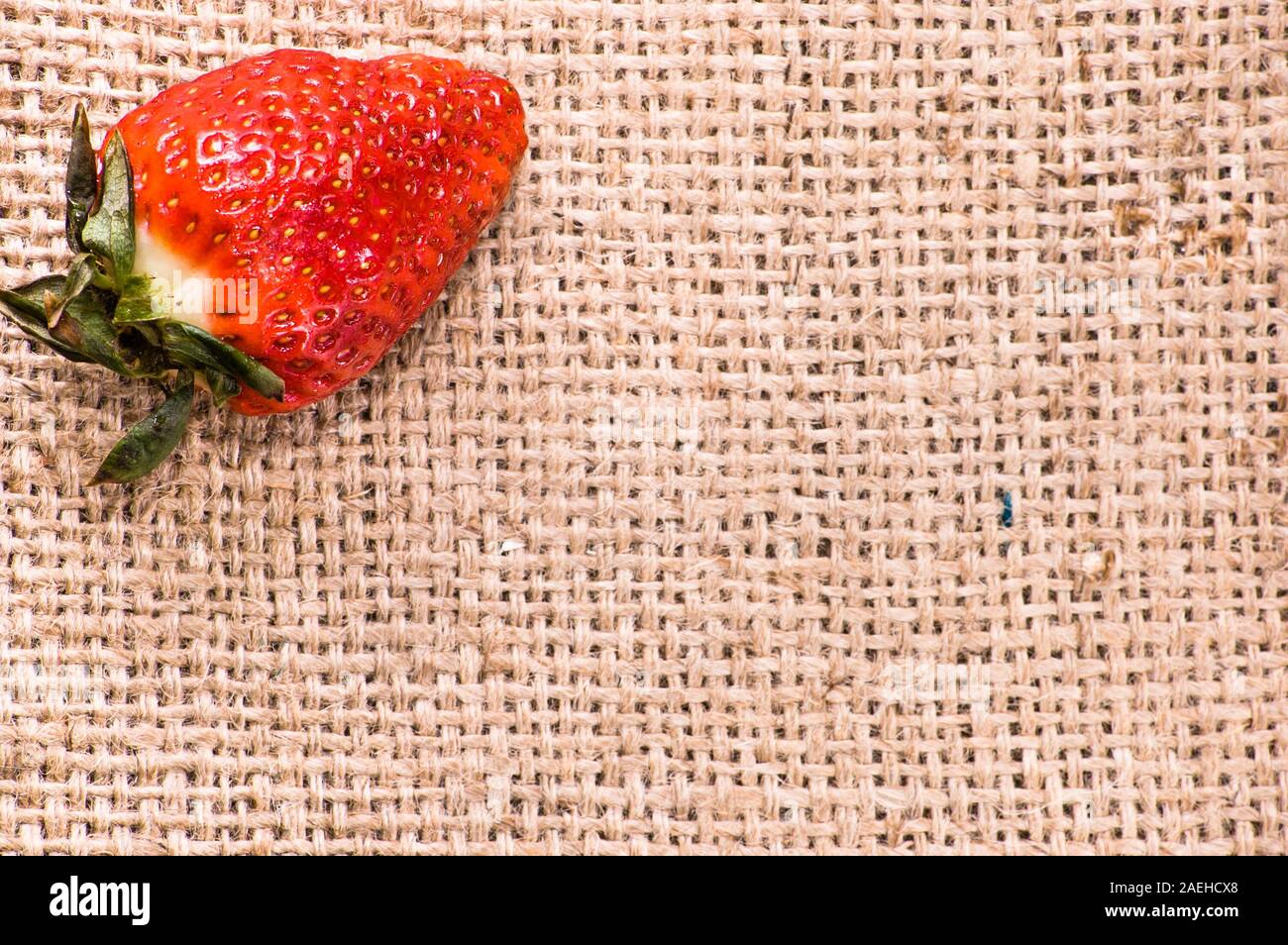 Red strawberry, fresh fruit on rustic background Stock Photo - Alamy