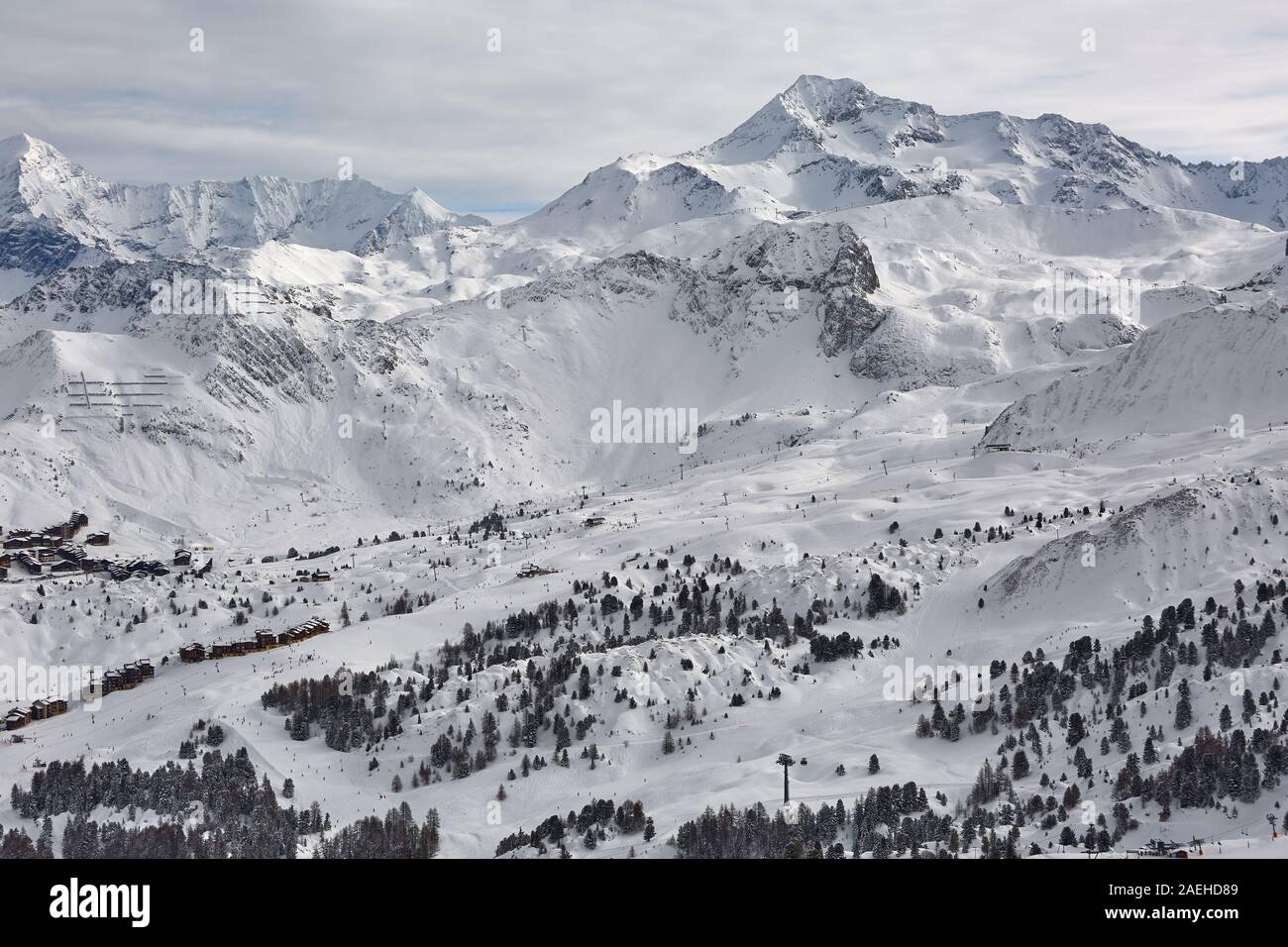 Skiing slopes, majestic Alpine landscape with trees Stock Photo - Alamy