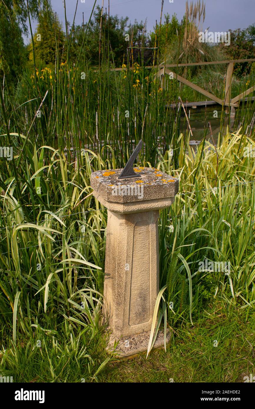 Sundial on stone pillar in english garden,England,Europe Stock Photo ...