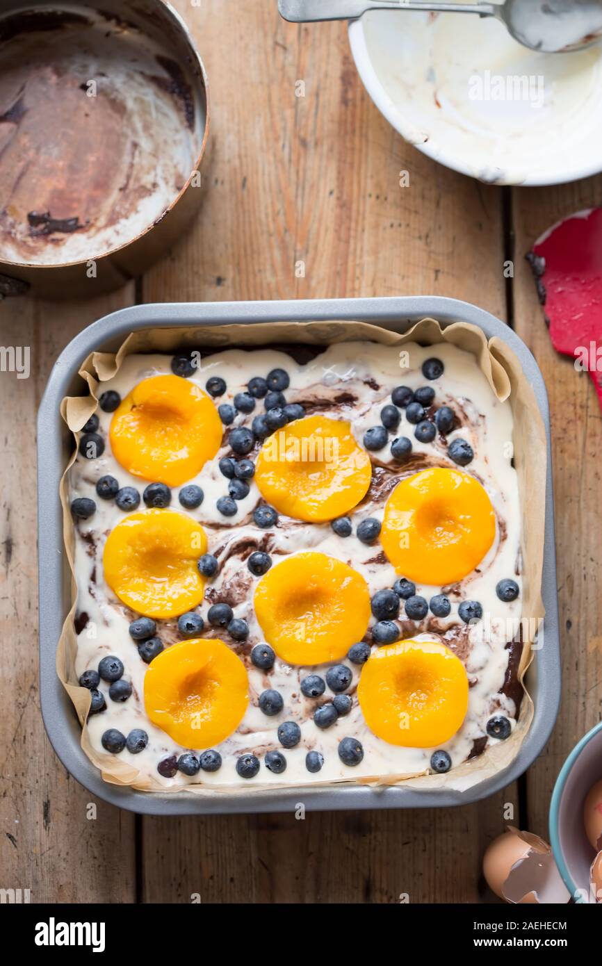 Unbaked oven ready cheesecake brownie cake with apricots and ...