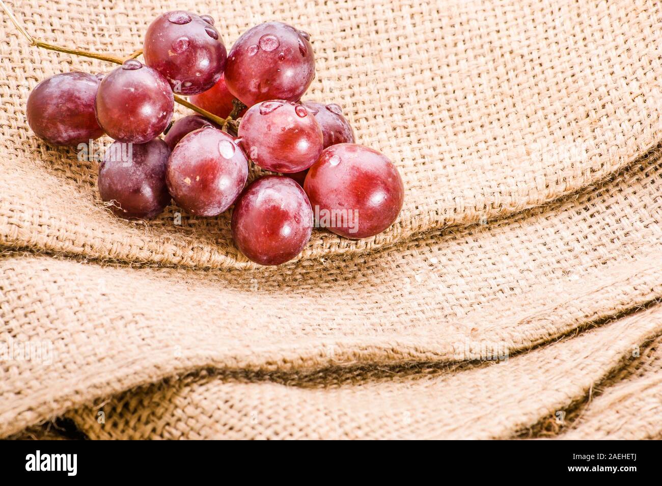 Red grapes, bunch on rustic background, healthy eating concept Stock ...