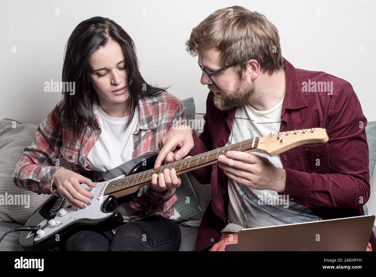 Woman listening man play hi-res stock photography and images - Alamy