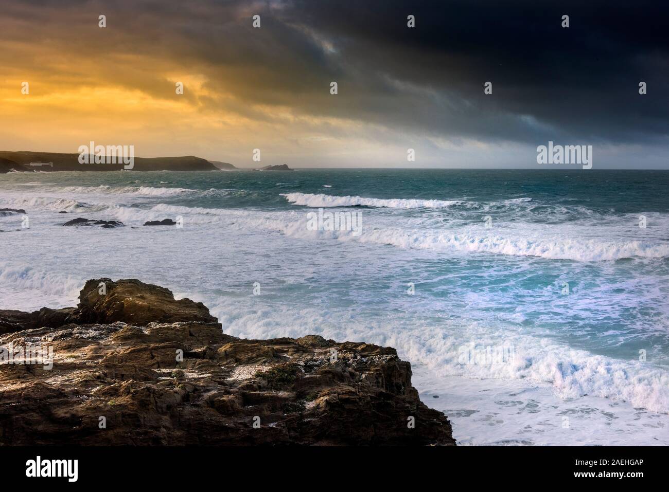 Setting sun over a windy Fistral Bay in Newquay in Cornwall Stock Photo ...