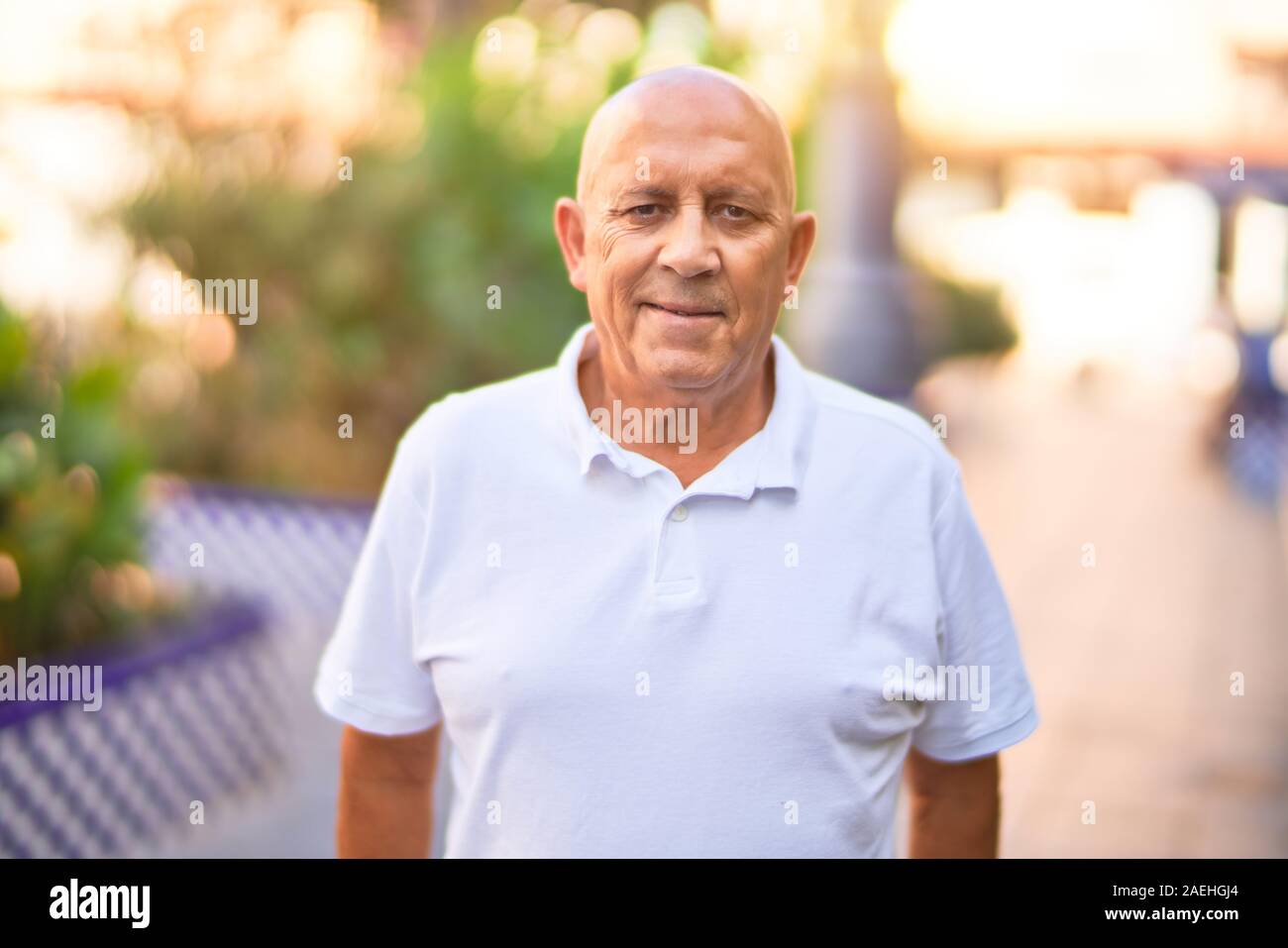 Senior handsome man smiling happy and confident. Standing with smile on ...