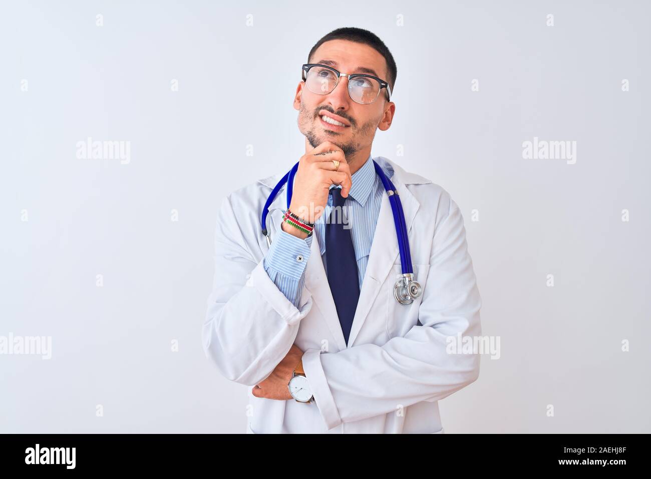 Young doctor man wearing stethoscope over isolated background Thinking ...