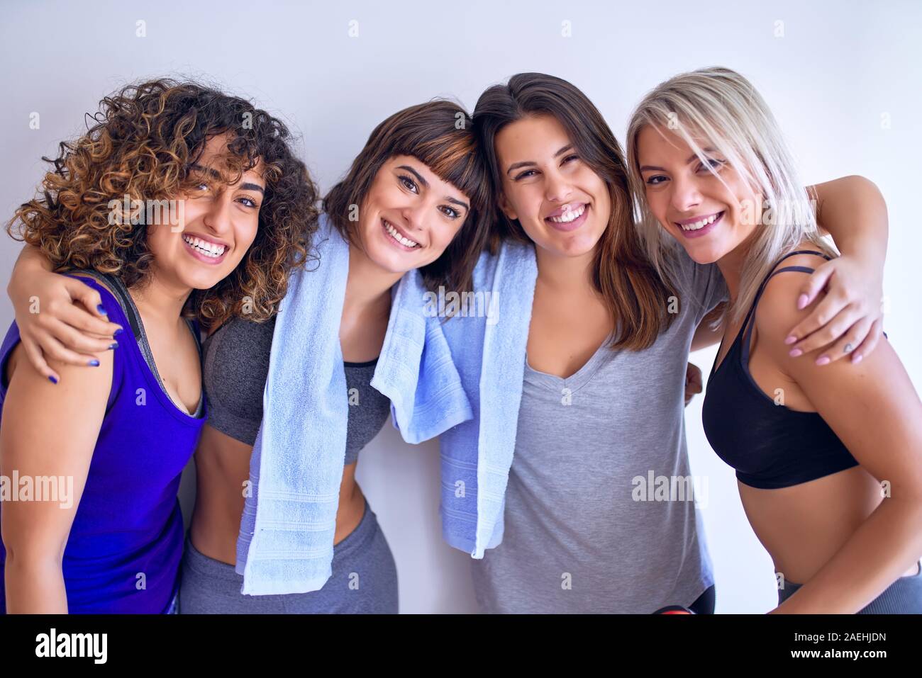 Young beautiful group of sportswomen smiling happy. Standing with smile ...