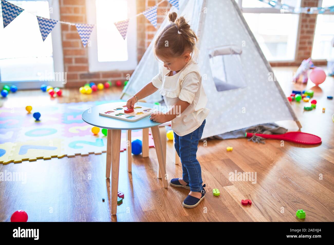 Young beautiful toddler learning mathematics playing with maths game at ...