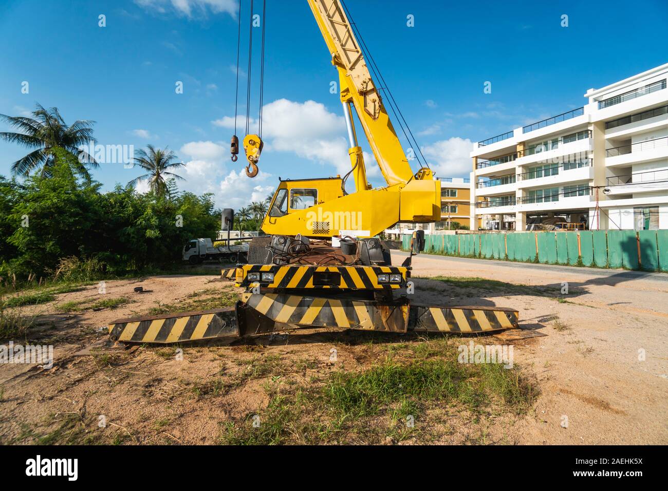 Yellow automobile crane with risen telescopic boom outdoors. Mobile ...