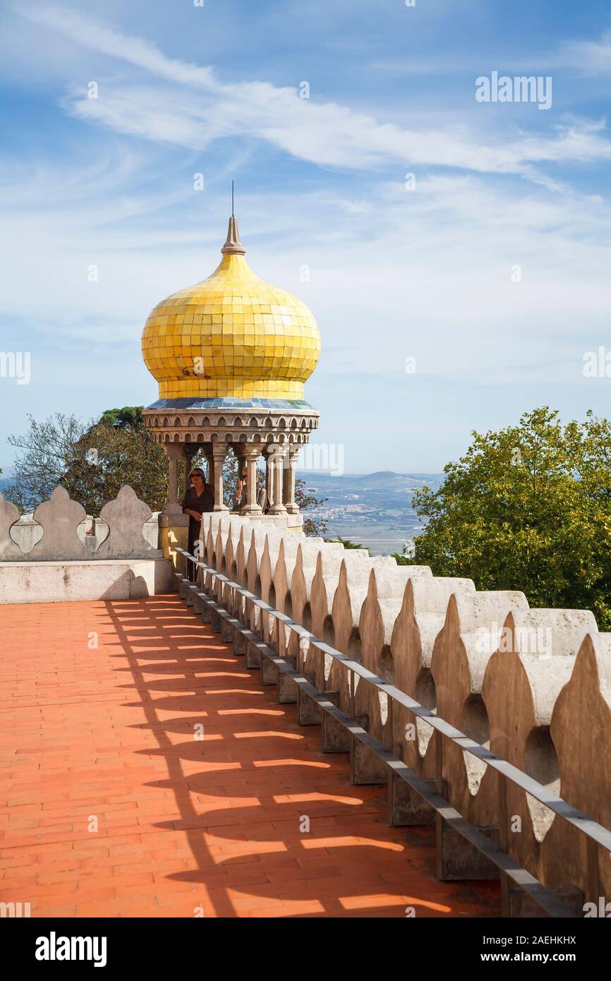 View of a gold domed round corner turret the ornate Pena Palace, in the ...
