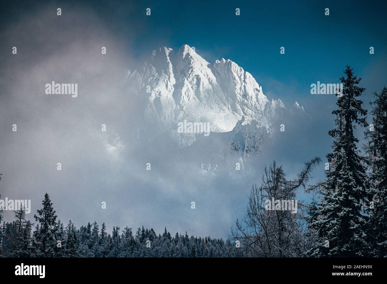 Big snowy mountains and blue sky. Winter nature Stock Photo - Alamy