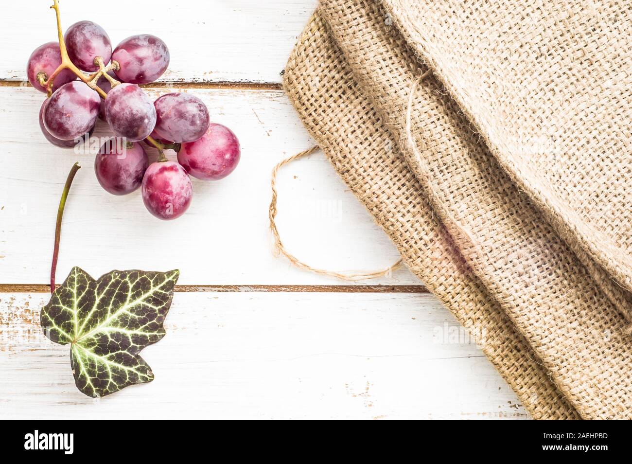 Red grapes, bunch on rustic background, healthy eating concept Stock ...