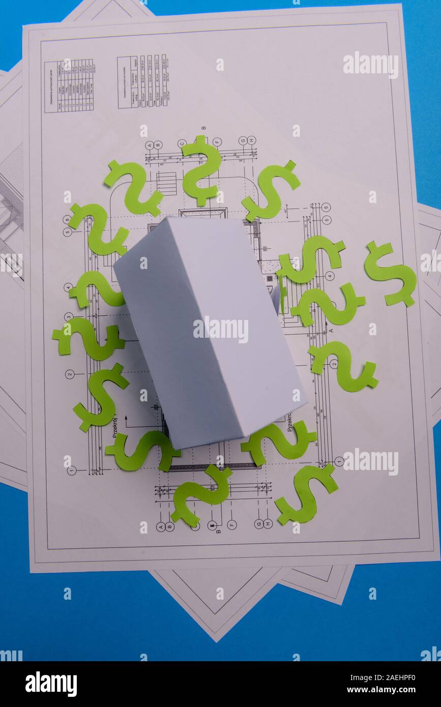 Paper skyscrapers , us dollar money, house projects plan and blueprints ...