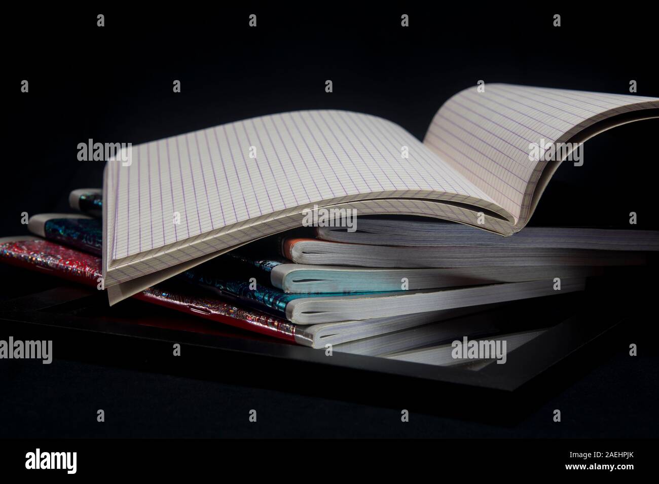 Pile of notebooks blue hi-res stock photography and images - Alamy