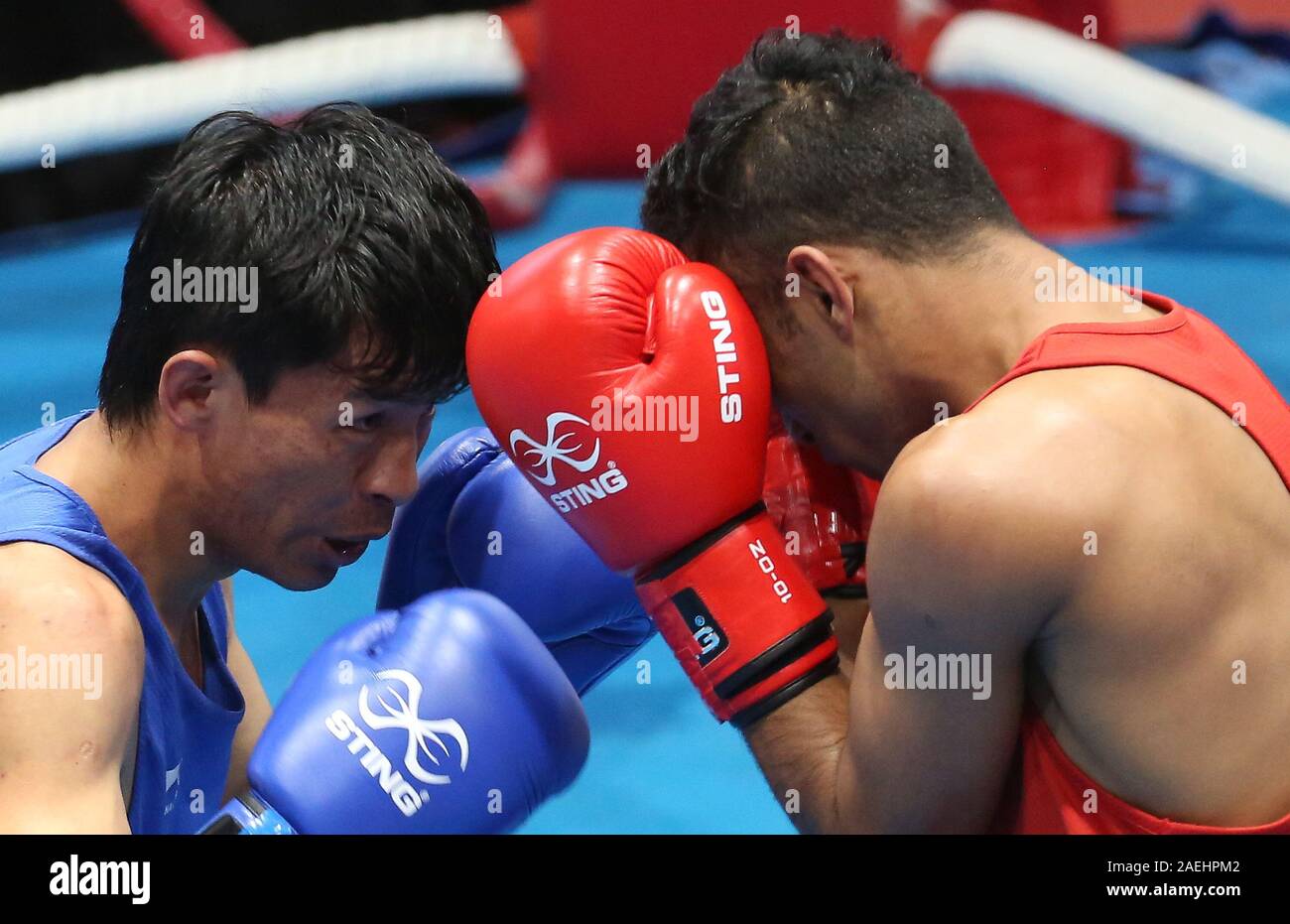 Kathmandu, Nepal. 9th Dec, 2019. Tashi Wangdi (L) of Bhutan competes ...
