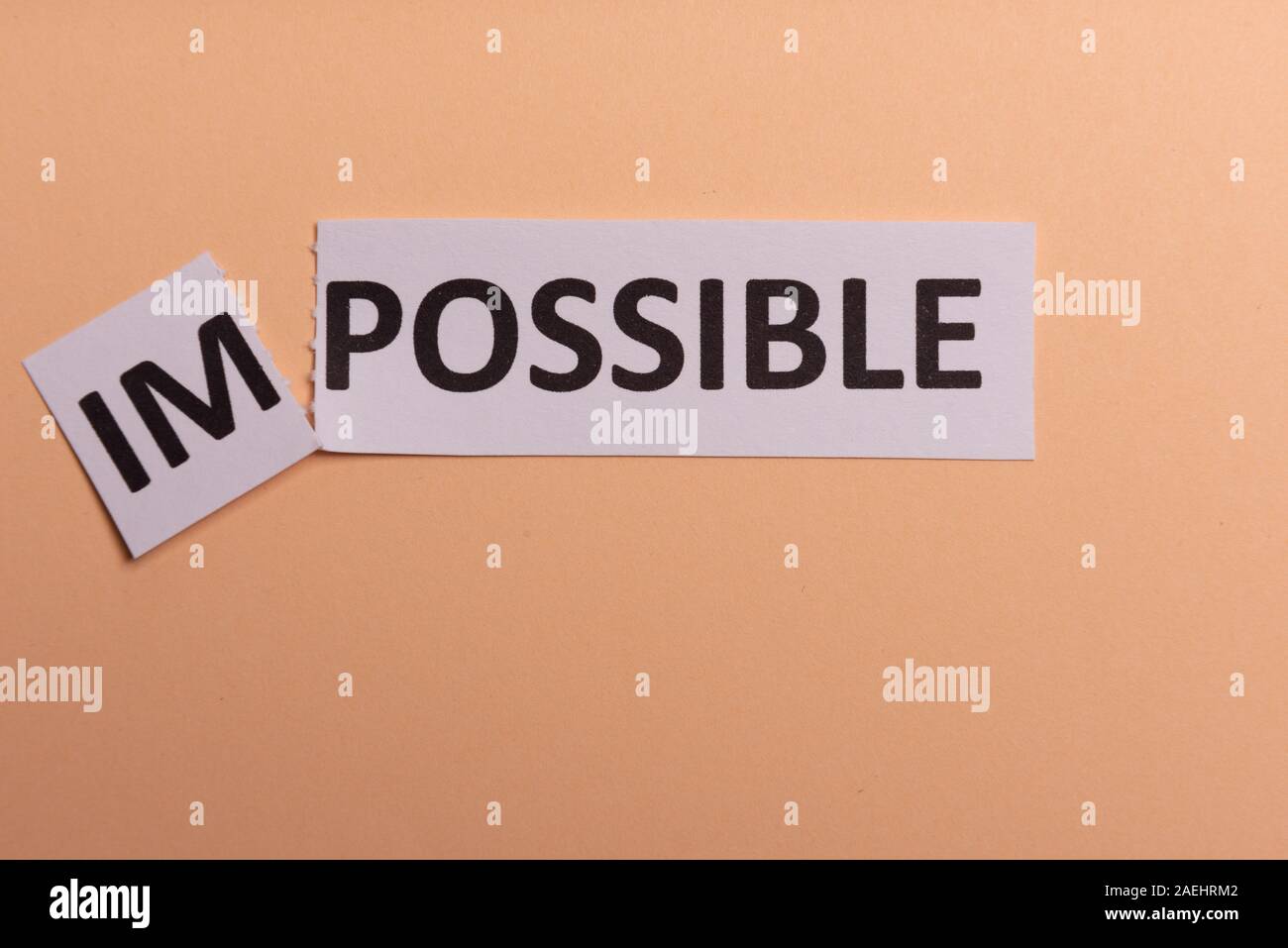 Impossible text cut out. Possible concept. Success. Pink background ...