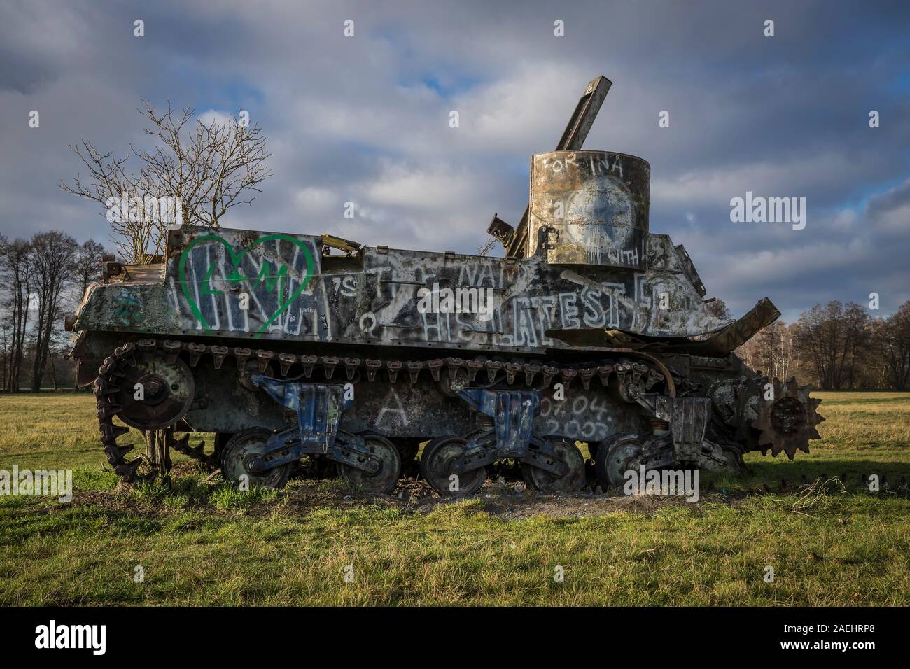 Old tank with graffiti Stock Photo - Alamy