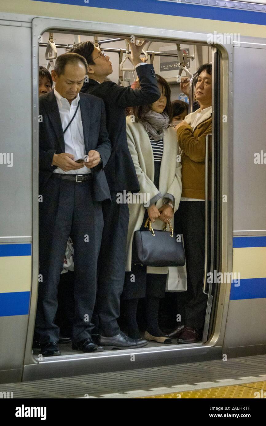 commuters on metro train,Tokyo Station, Japan Stock Photo - Alamy