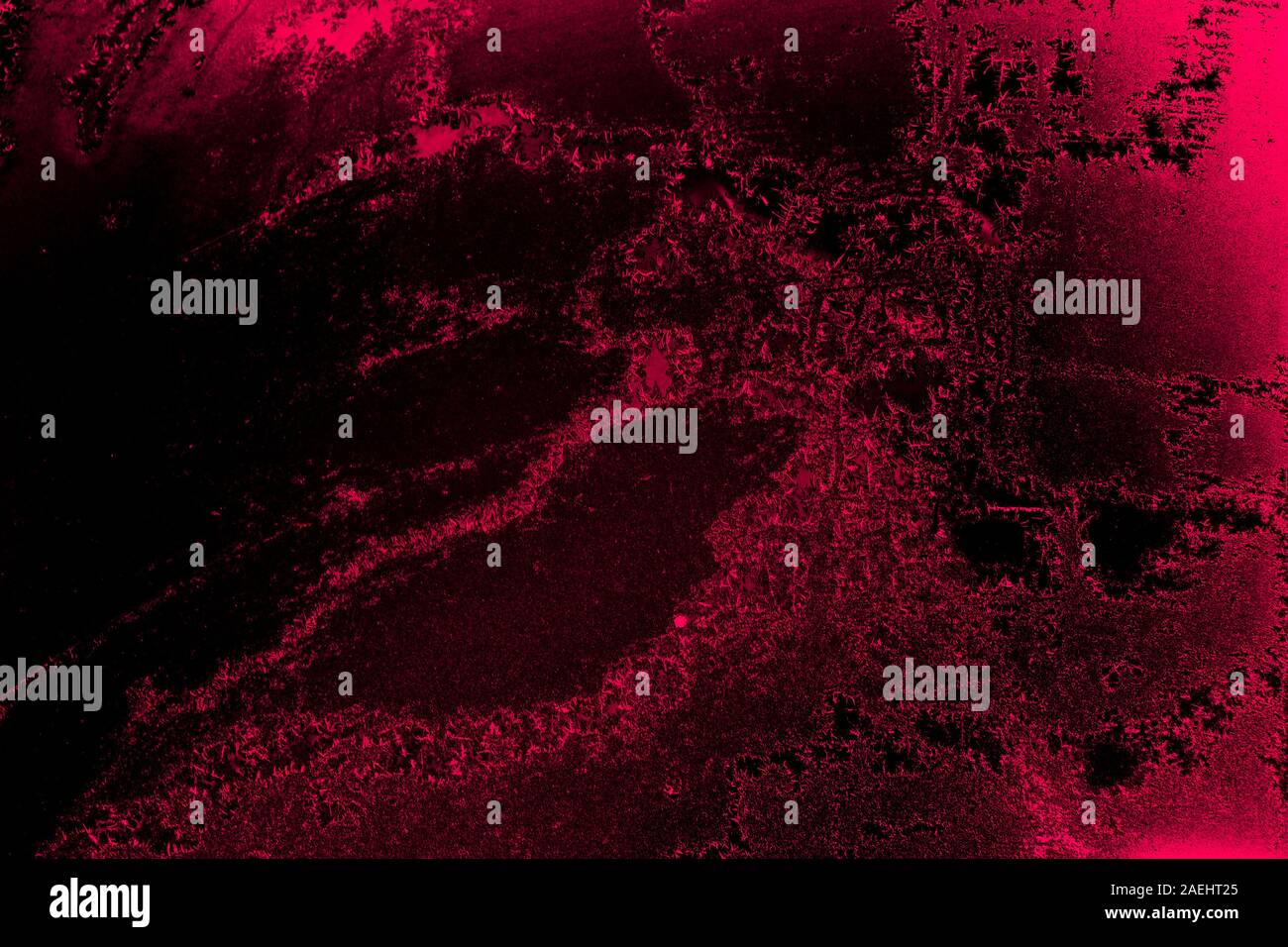 red colored background with ice textures of different shades of red ...