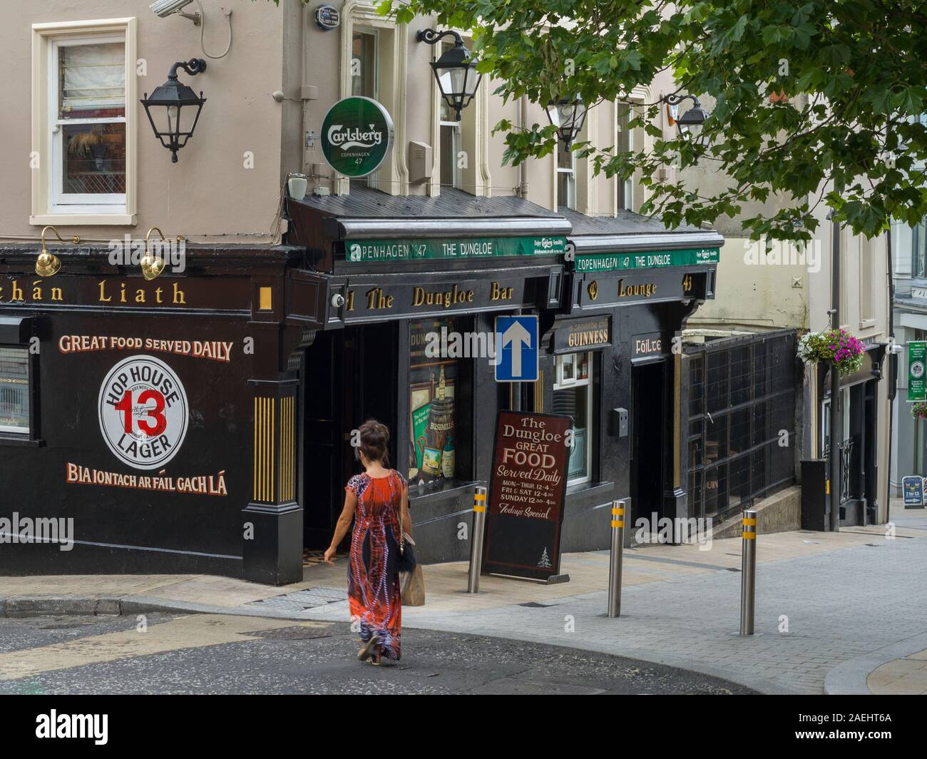 Woman walking into bar rear view hi-res stock photography and images ...