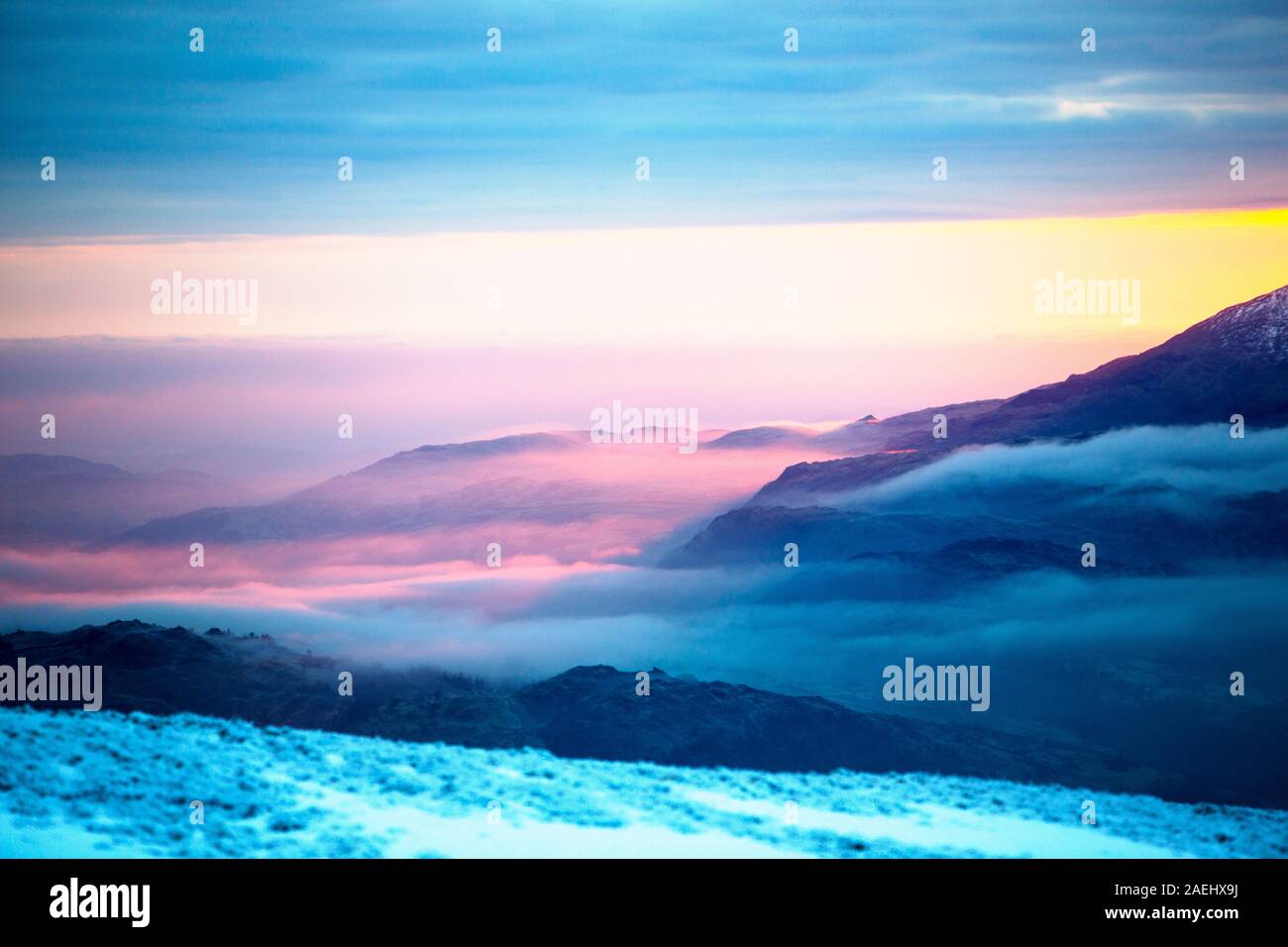 Red Screes above Ambleside with mist from a temperature inversion, Lake ...