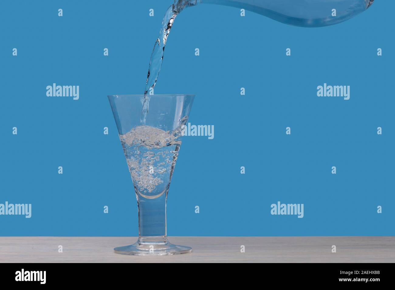 water glass being filled with fresh water Stock Photo - Alamy