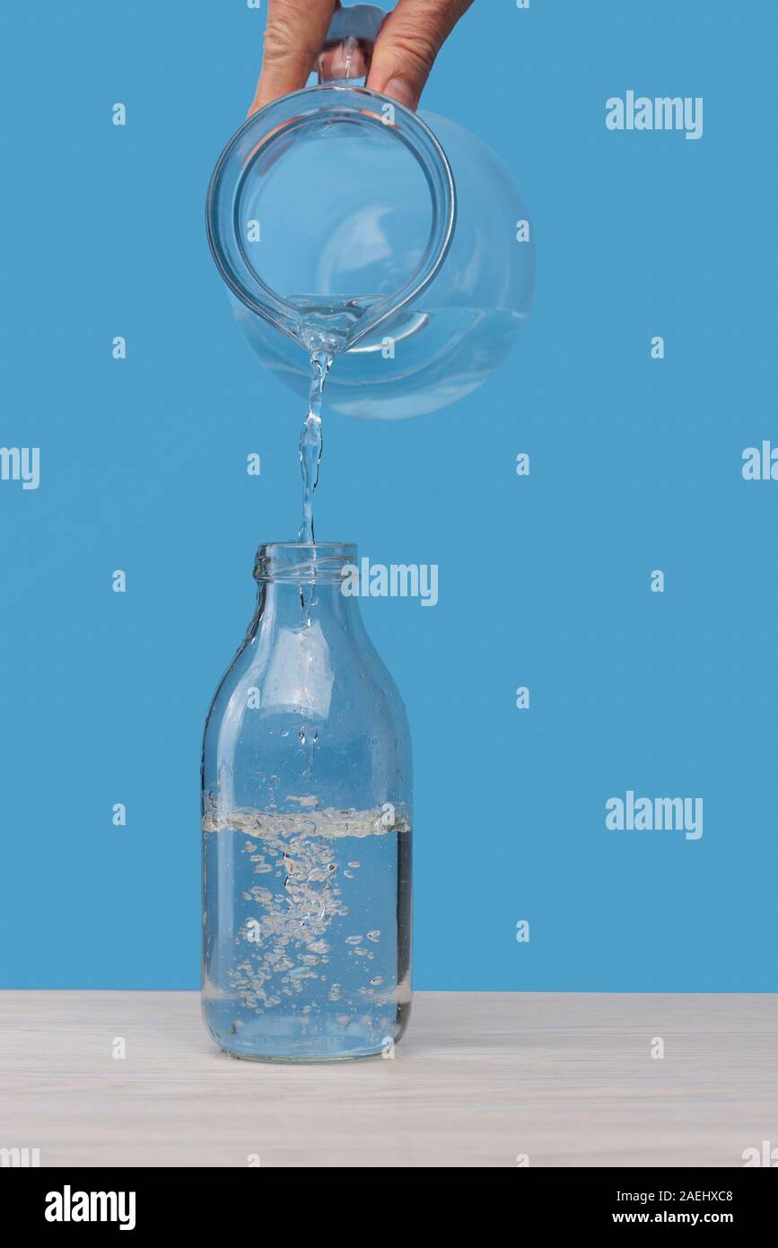 Closeup bottle water pouring hi-res stock photography and images - Alamy