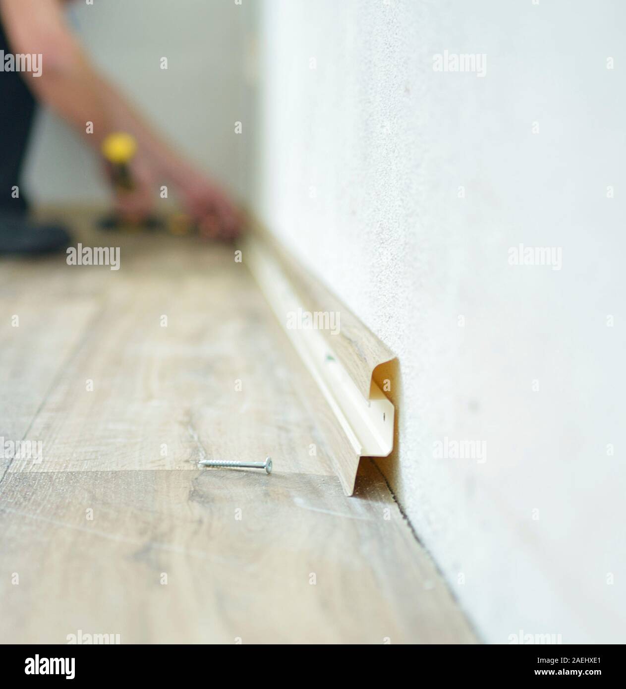 assembly of the molding on a floating floor Stock Photo - Alamy