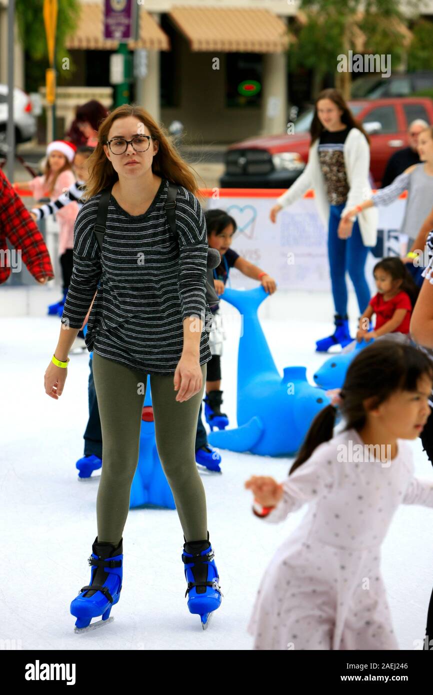 People enjoying the outdoor ice skating rink in downtown Tucson AZ ...